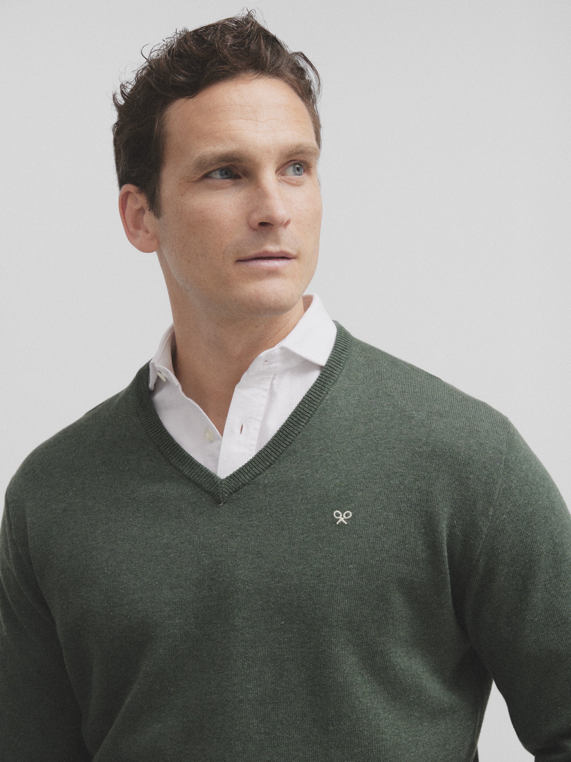 Green V-neck sweater