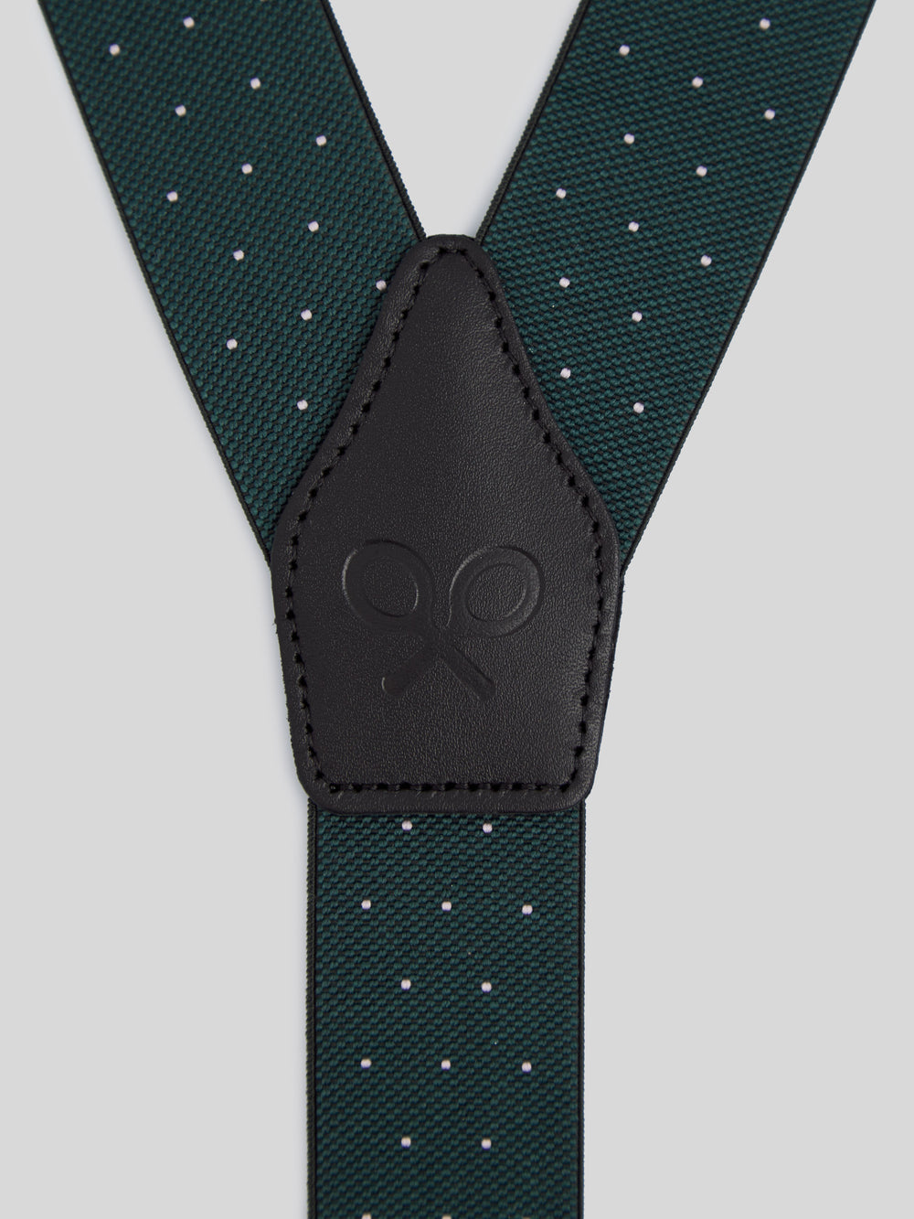Silbon brace with green dots